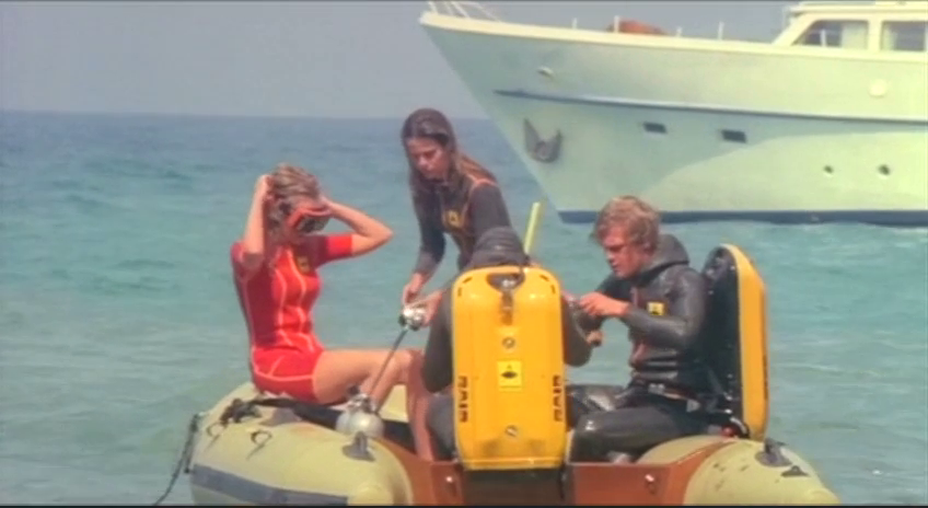 2 frogwomen and 2 frogmen in vintage scuba gear [....and one gets stuck ...