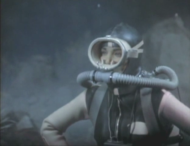 Frogwomen and frogmen in vintage rubber suits..... in an "underwater ...