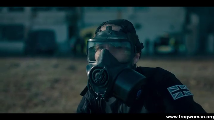 A female bomb squad leader with gas mask in several scenes - Frogwoman Org